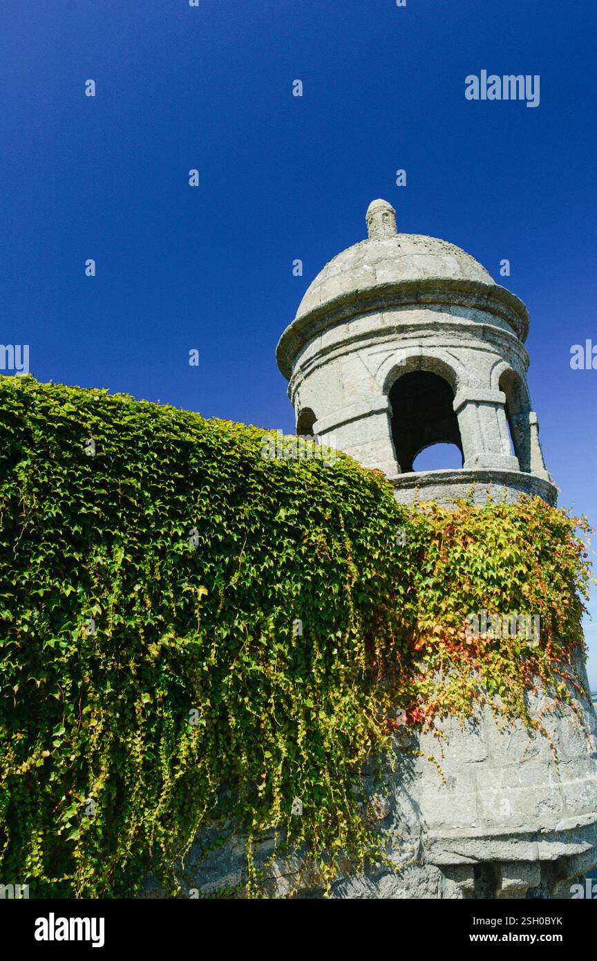 A round turret covered in ivy on a summer’s day in Roscoff, France ...