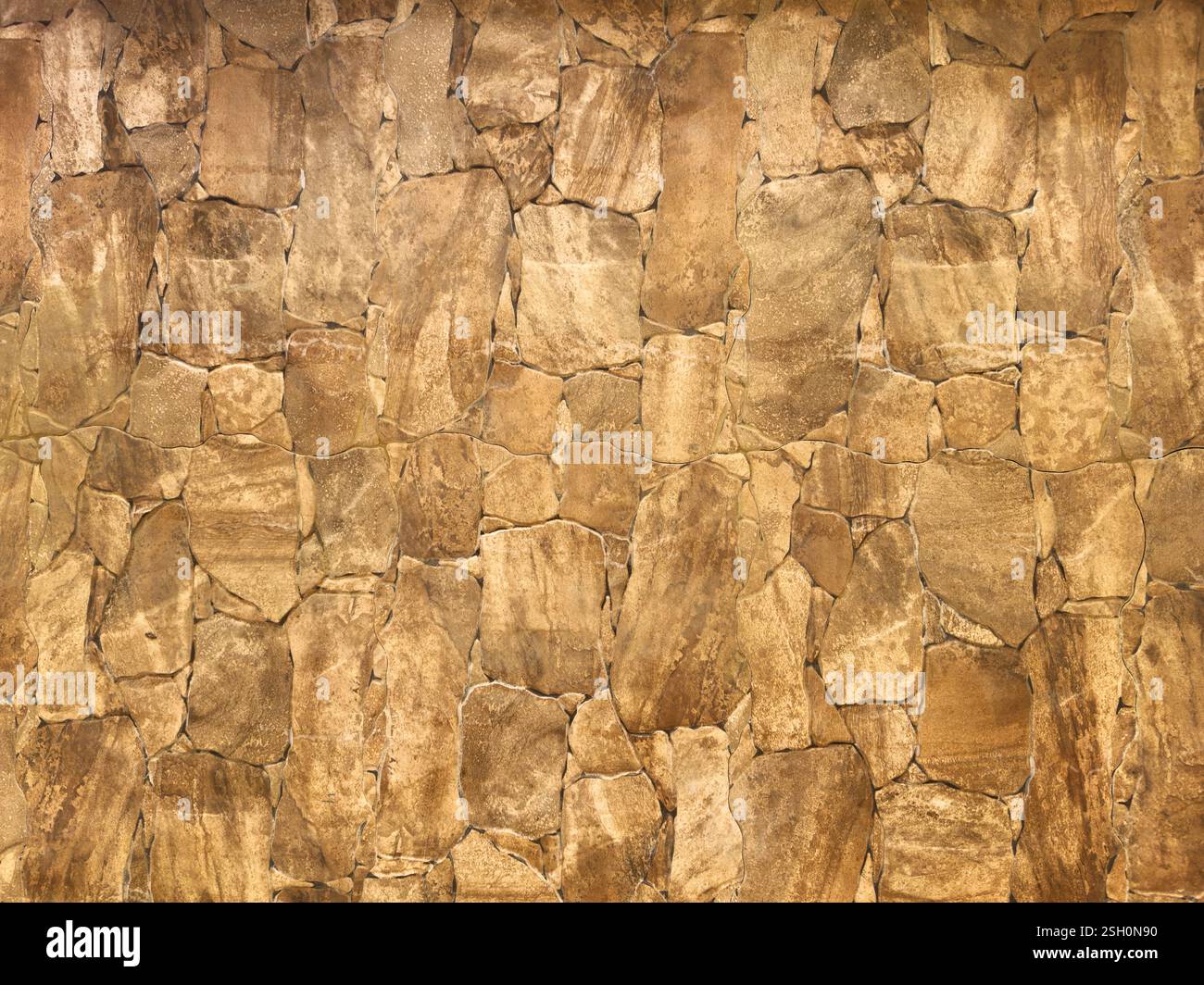 Detailed stone wall showcases array of sizes and shapes in warm earth tones, ideal for rustic ...