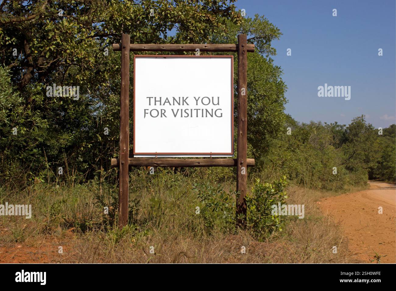 Thank you for visiting sign board alongside dirt road road in Africa ...