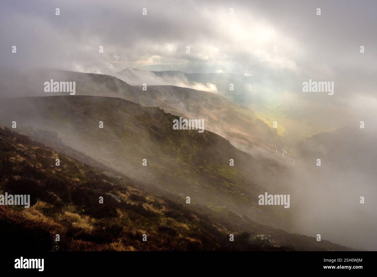 Mist clinging to the southern edge of Kinder Scout above Edale in the ...