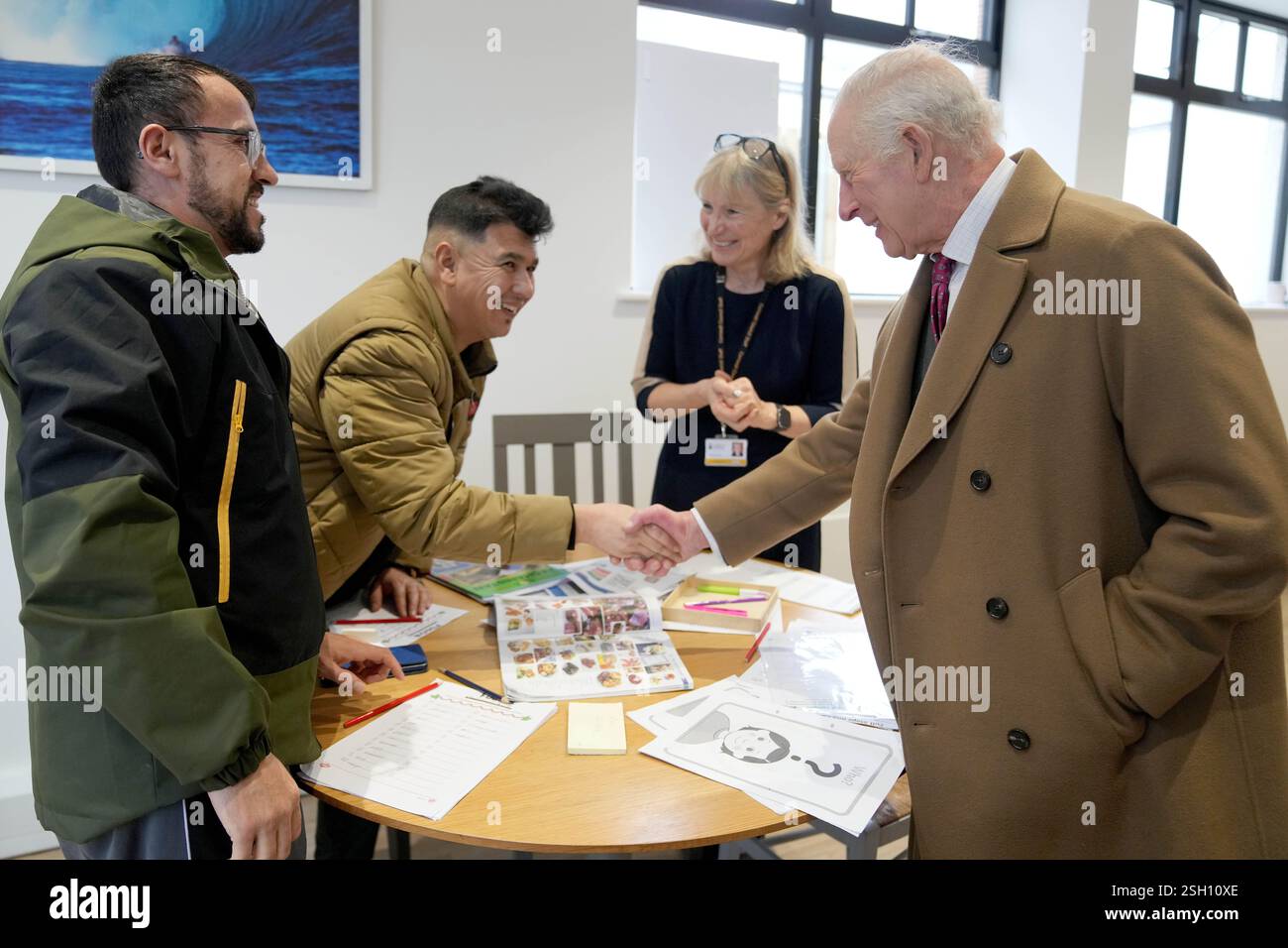 King Charles III meets a refugee family from Afghanistan at the ...