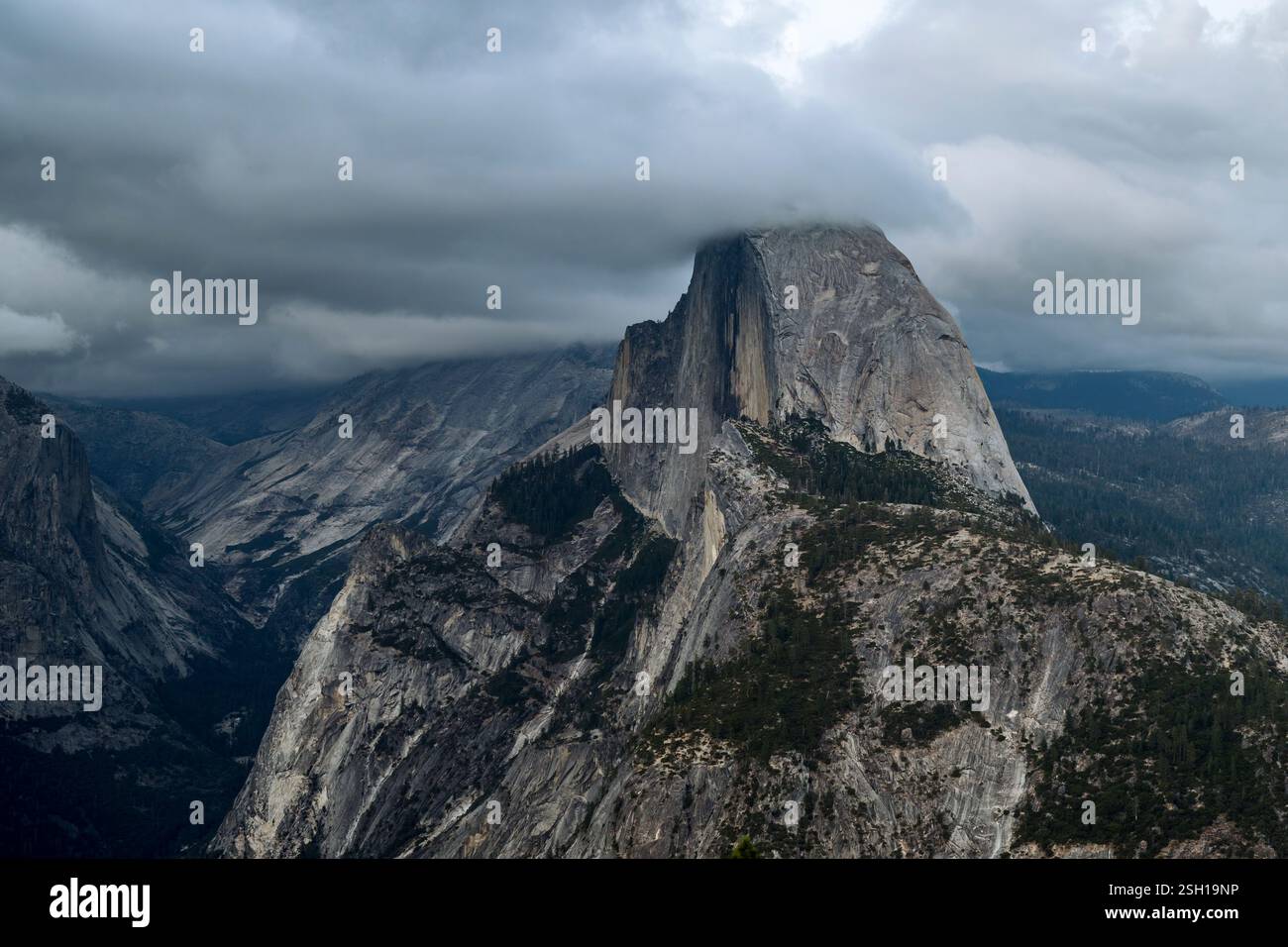 Sunset on Half Dome, as seen from Glacier Point. The tip of half dome ...