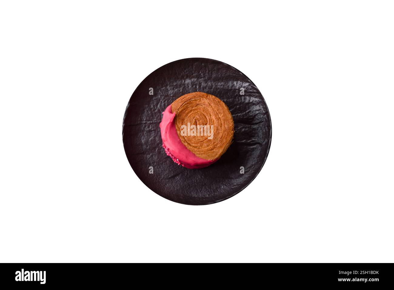 Round sweet New York roll croissant with raspberry cream filling on a ...