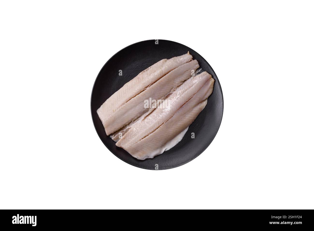 Herring fillet salted and marinated with salt, spices and oil on a ...