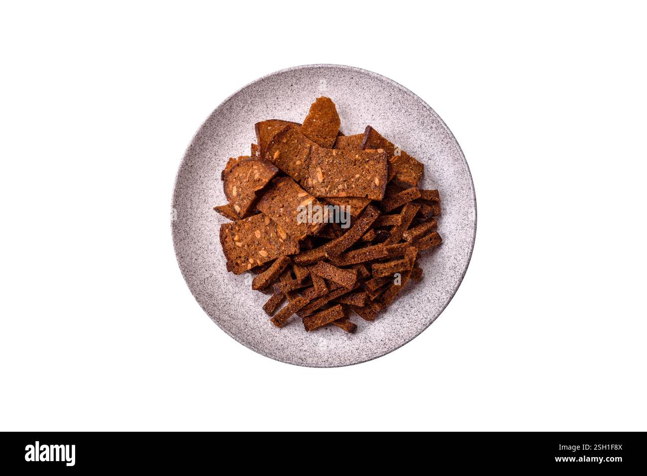 Crispy homemade brown bread crackers or croutons with seeds and grains ...