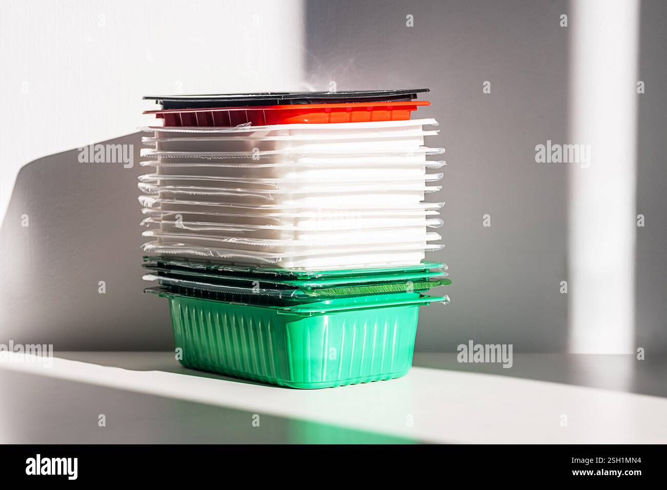 Pile of disposable plastic food containers ready for sorting and ...
