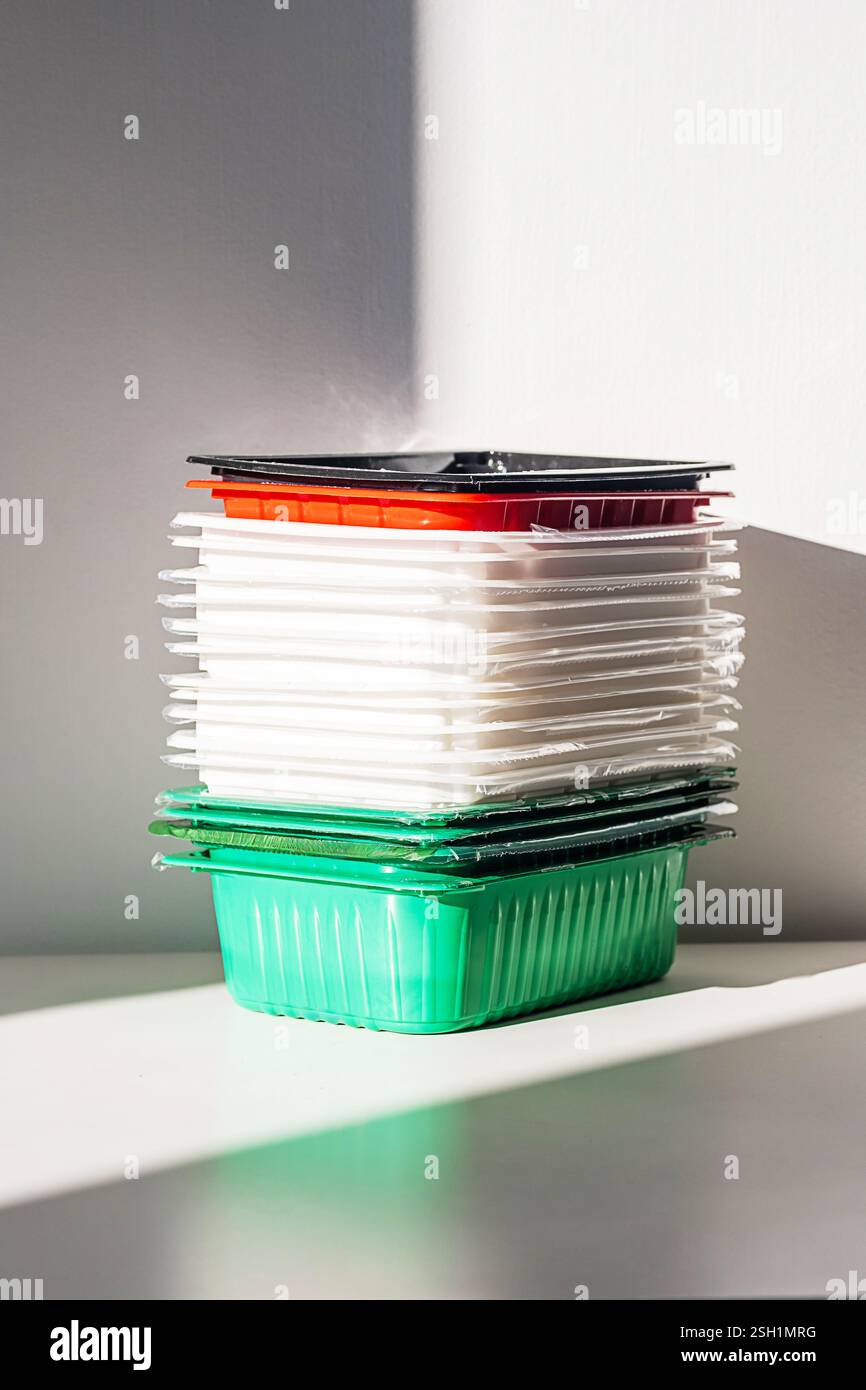 Pile of disposable plastic food containers ready for sorting and ...