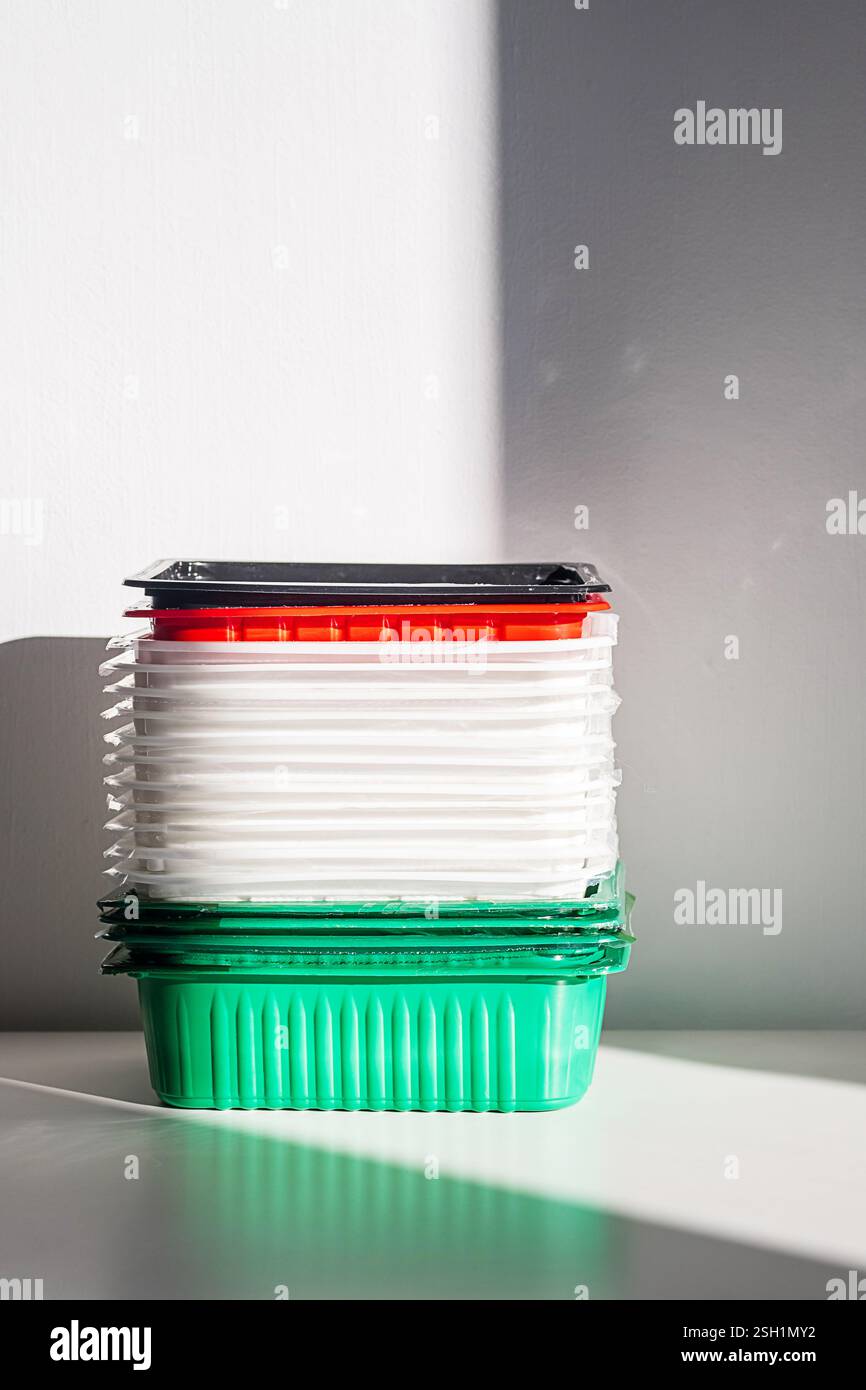 Pile of disposable plastic food containers ready for sorting and ...