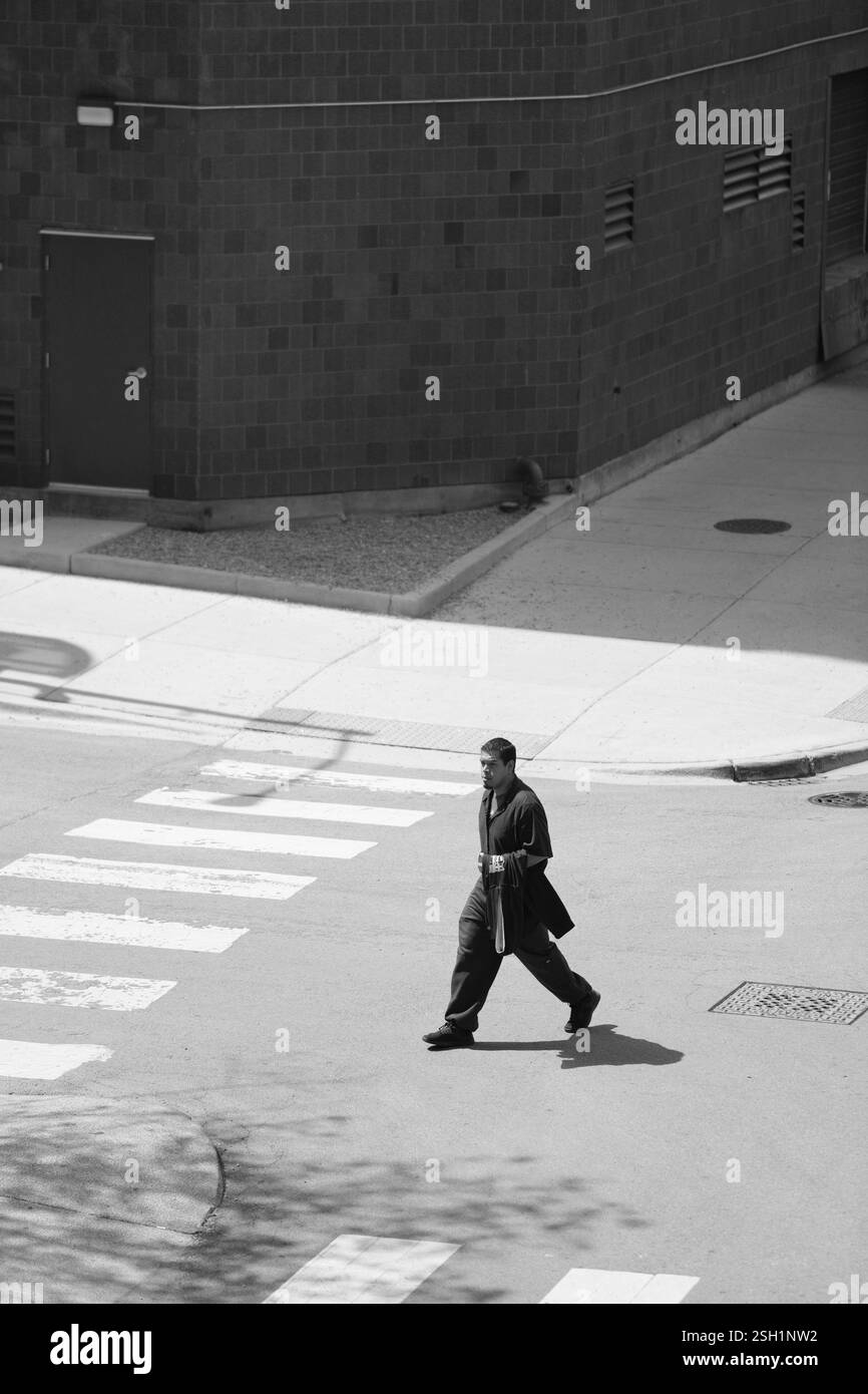 Man Walking Across a City Crosswalk – Urban Minimalist Black & White ...
