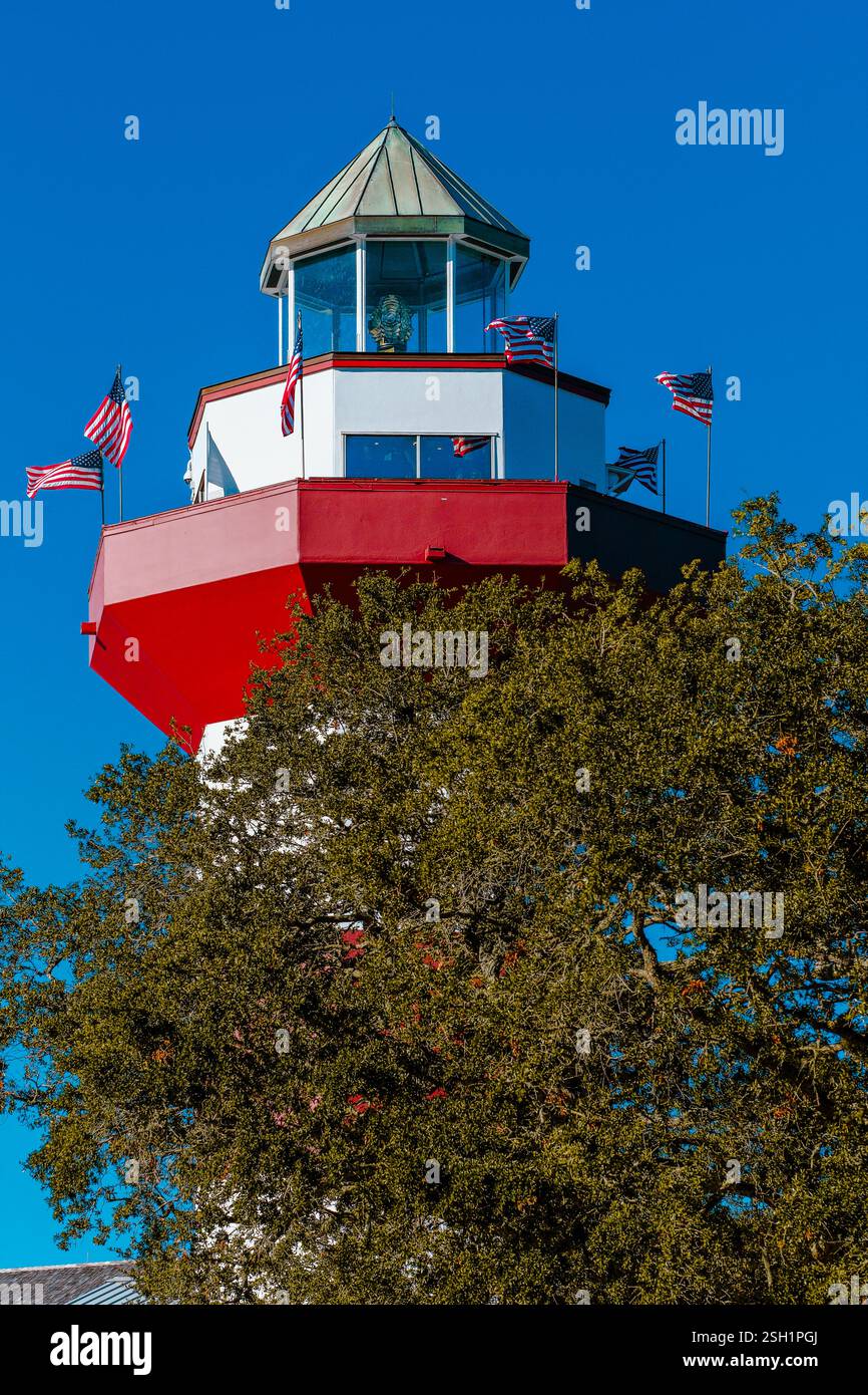 Harbour Town Lighthouse with American Flags Stock Photo - Alamy