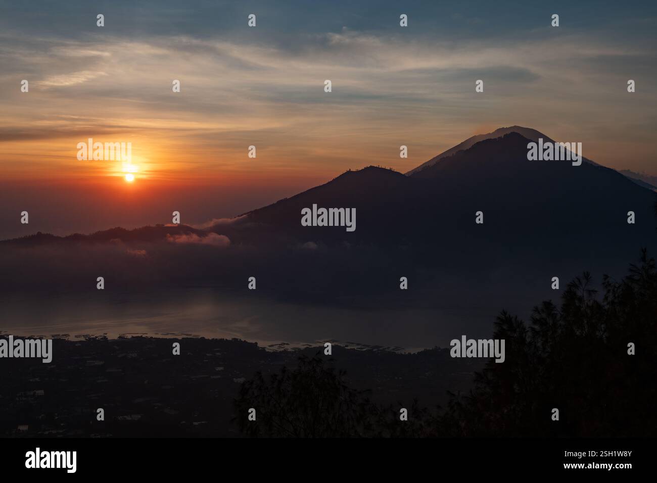 Sunrise view of Mount Abang and Lake Batur from the ascent of Mt. Batur ...