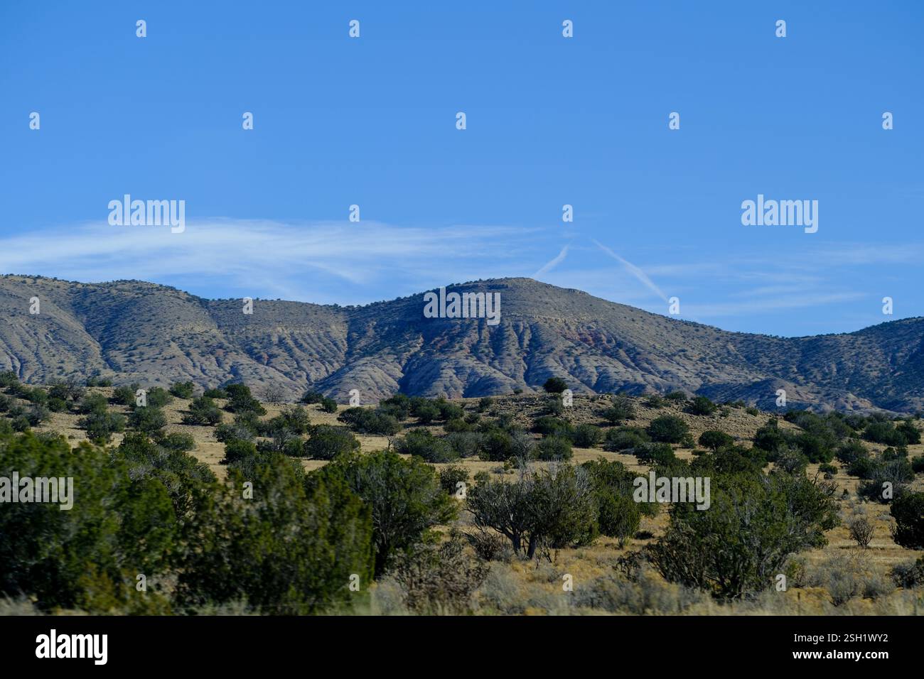 Hilly Landscape with Mountain Range Stock Photo - Alamy