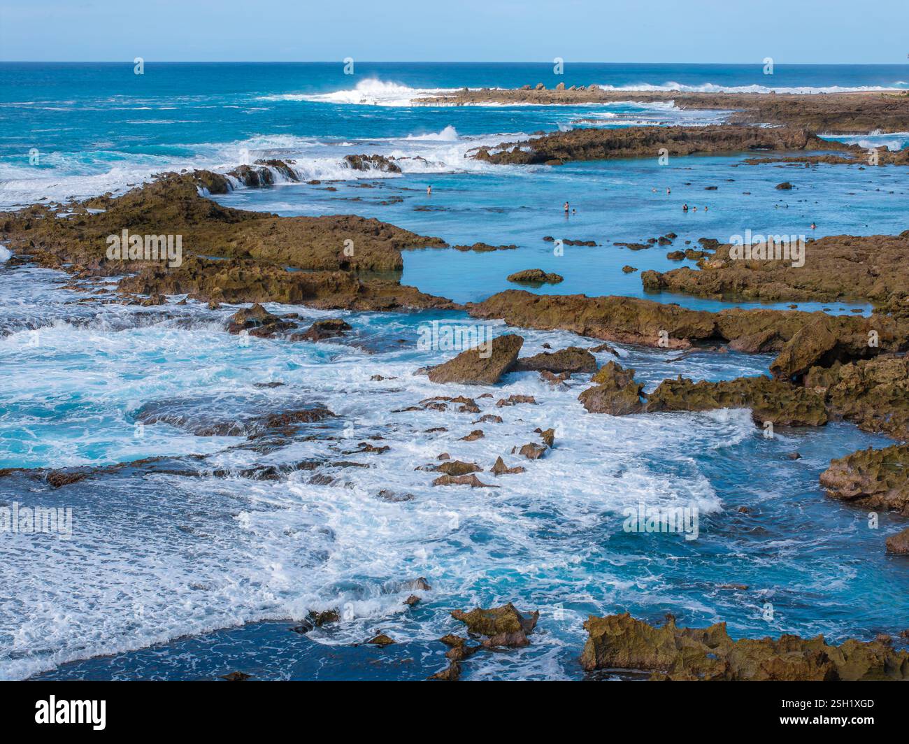 Aerial View of Sharks Cove on Oahu Island with Swimmers and Tide Pools ...
