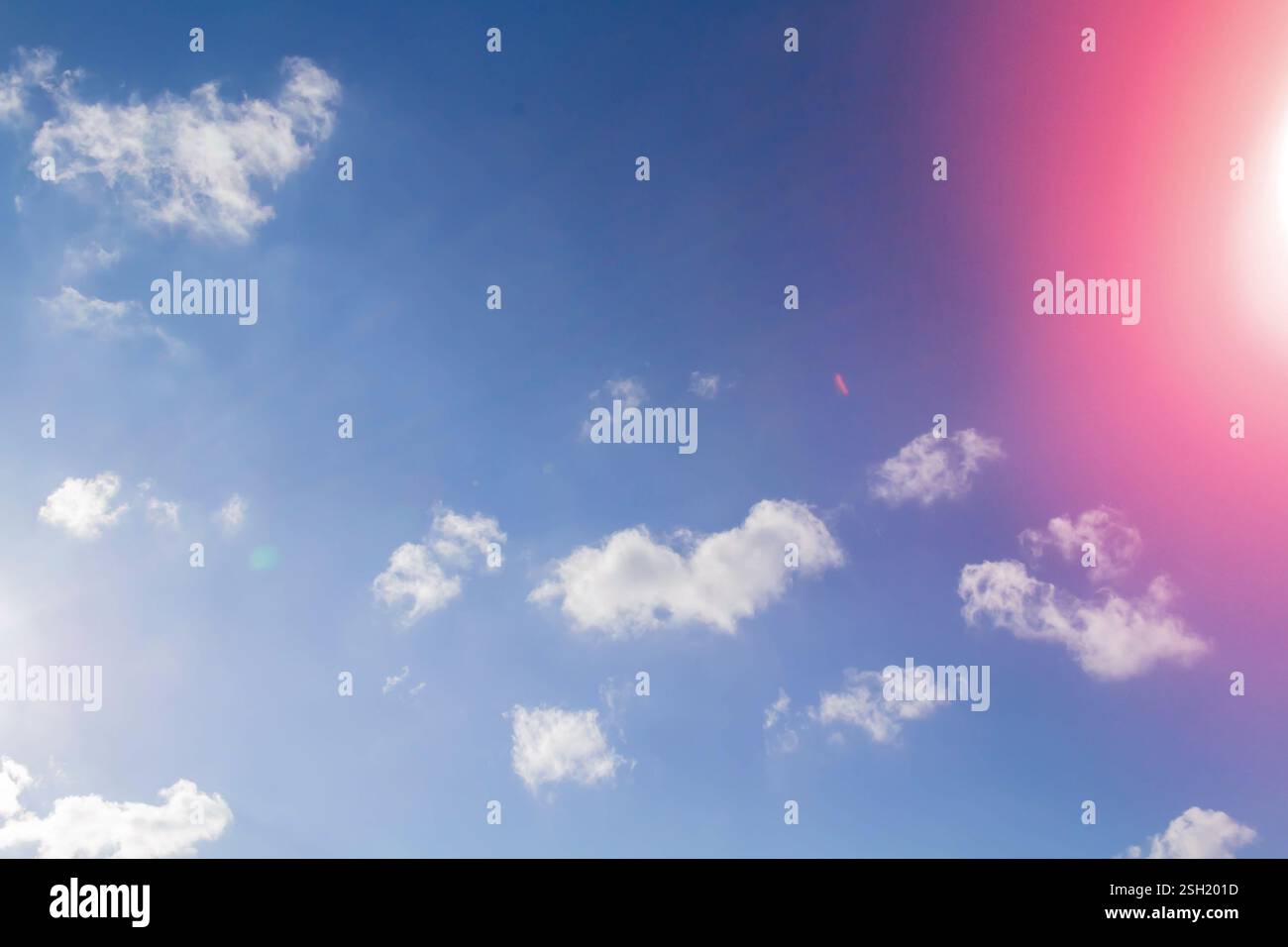 White airy beautiful clouds in a bright blue sky. Clear sunny weather ...