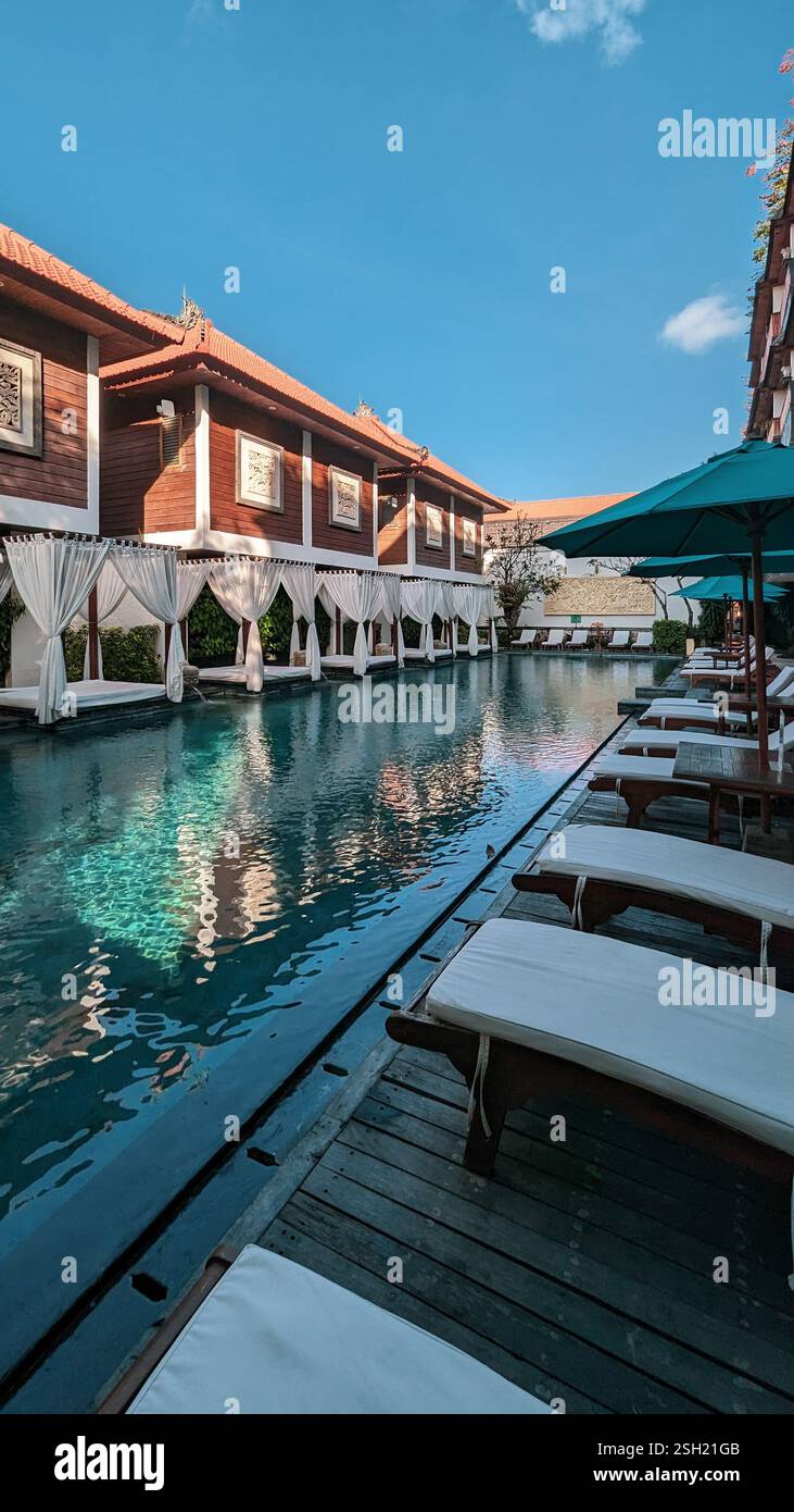 Luxury Poolside Retreat at Traditional Resort Stock Photo - Alamy