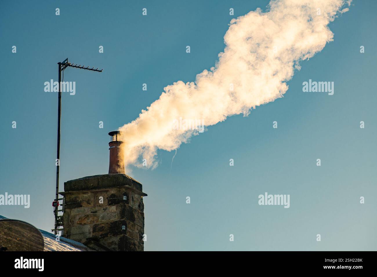 Wood smoke from a wood burning stove coming out of a chimney ...