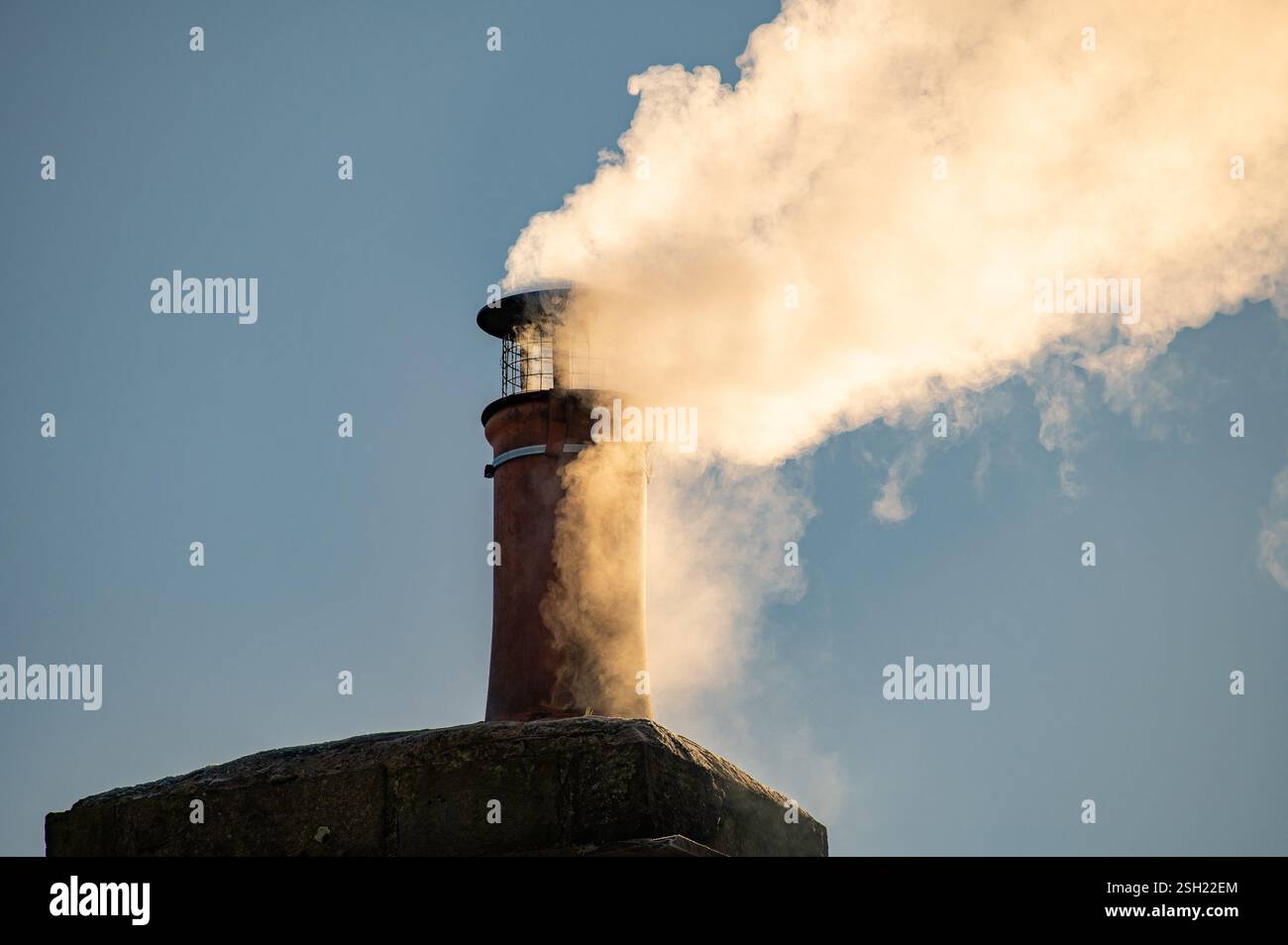 Wood smoke from a wood burning stove coming out of a chimney ...