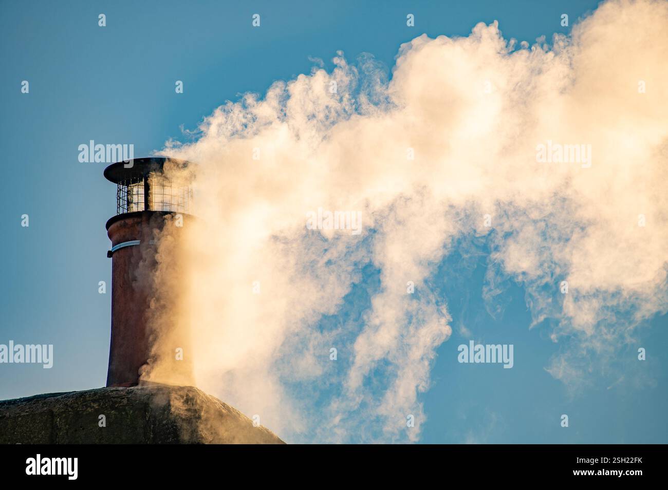 Wood smoke from a wood burning stove coming out of a chimney ...