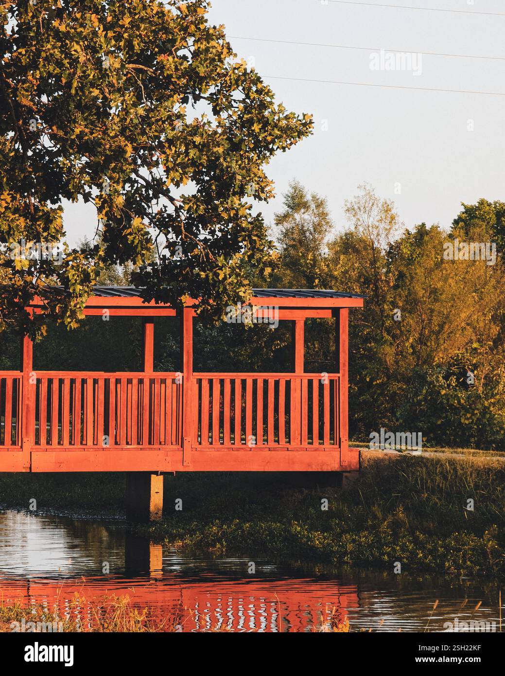 Red Bridge Over Water Stock Photo - Alamy