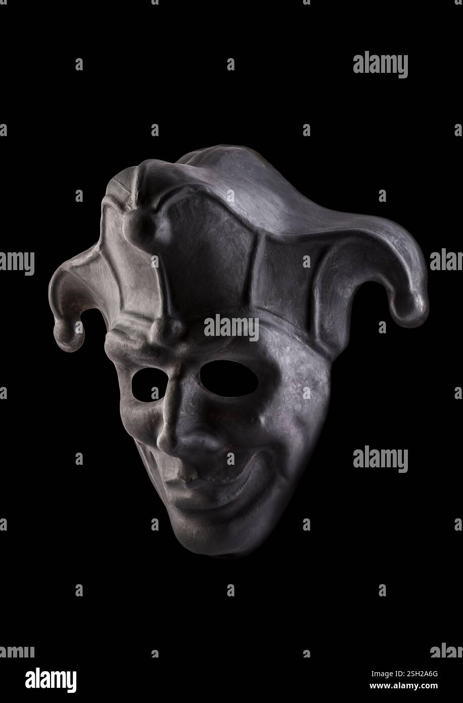 Dark medieval clown mask isolated on black background with clipping ...