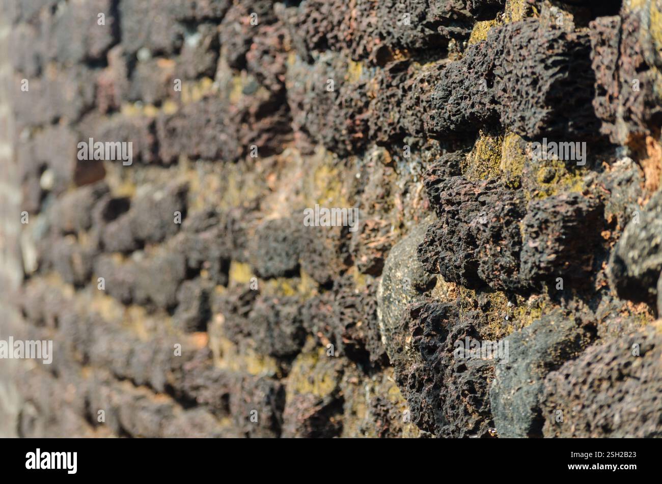A corroded stone wall of a fort in Kerala, India Stock Photo - Alamy