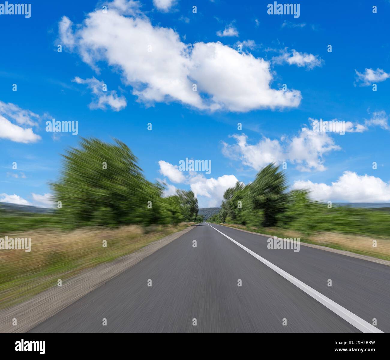 A lonely road stretches into the distance Stock Photo - Alamy