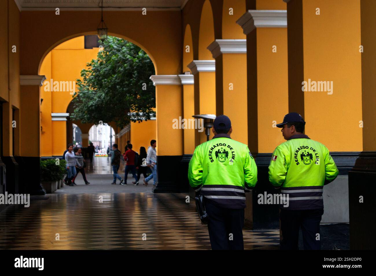 Police Officer (Serenazgo) Walking Under Yellow Colonial Architecture ...
