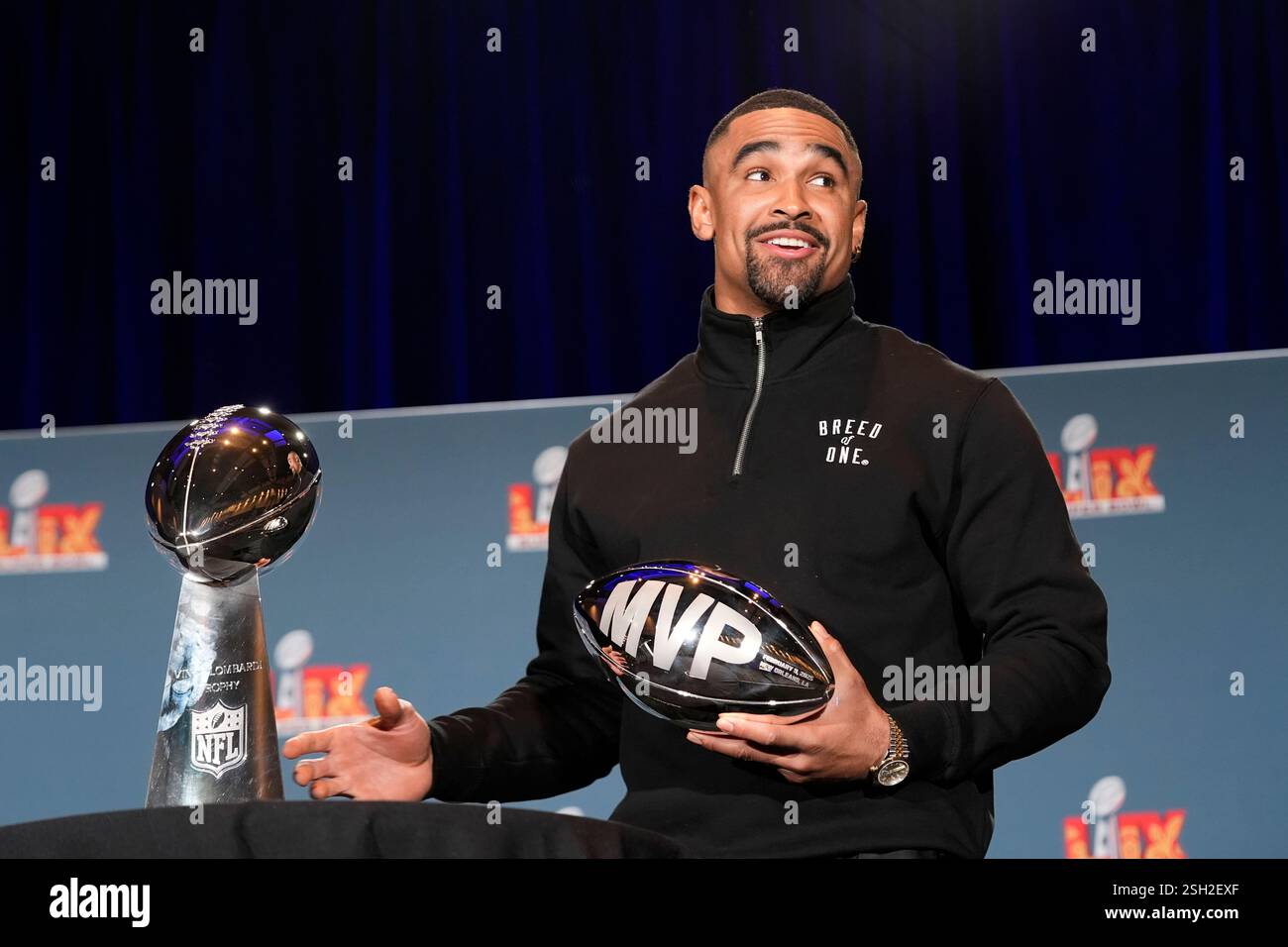 Philadelphia Eagles quarterback Jalen Hurts poses with the Vince Lombardi trophy and the Pete ...