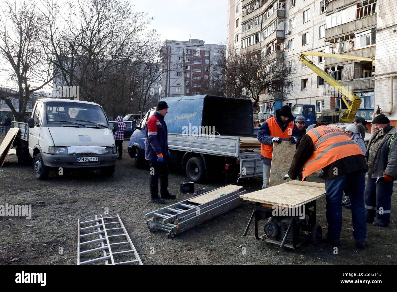 KRAMATORSK, UKRAINE - FEBRUARY 10, 2025 - Municipal workers cut OSB ...