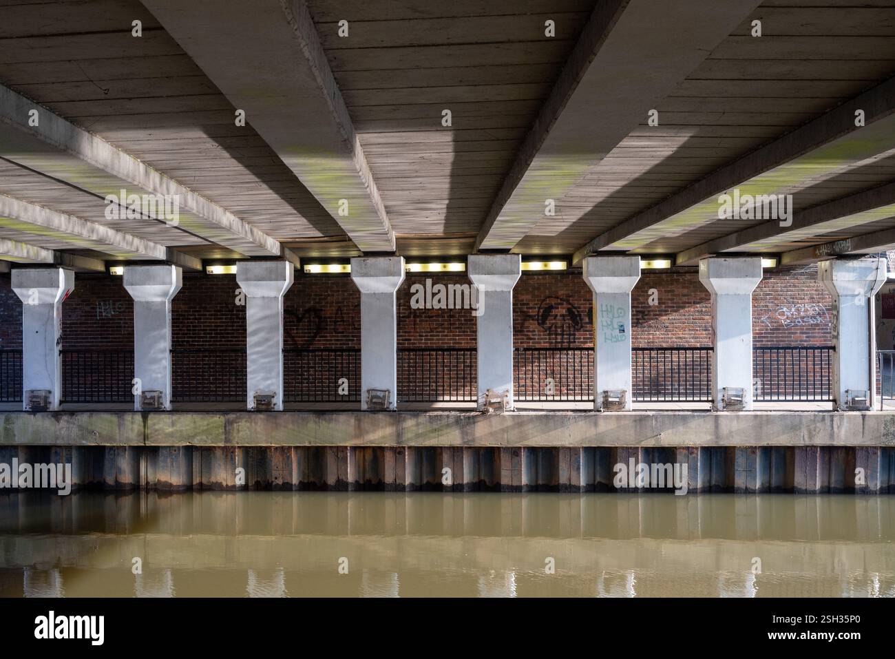 Shapes and shadows of the pillars under a city bridge in England ...