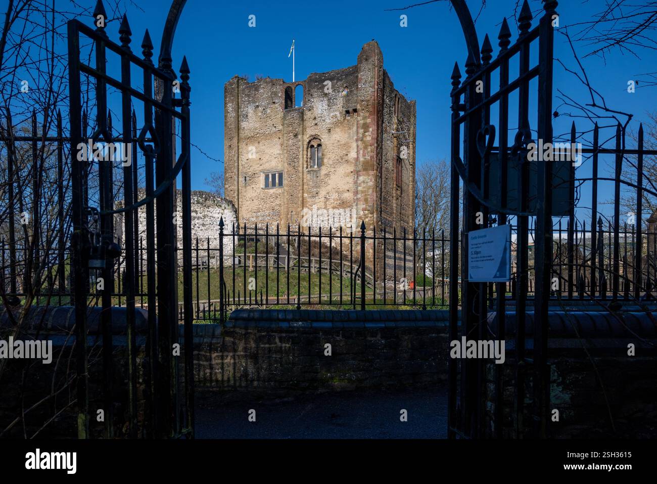 The keep of Guildford castle, seen from the grounds and framed by an ...