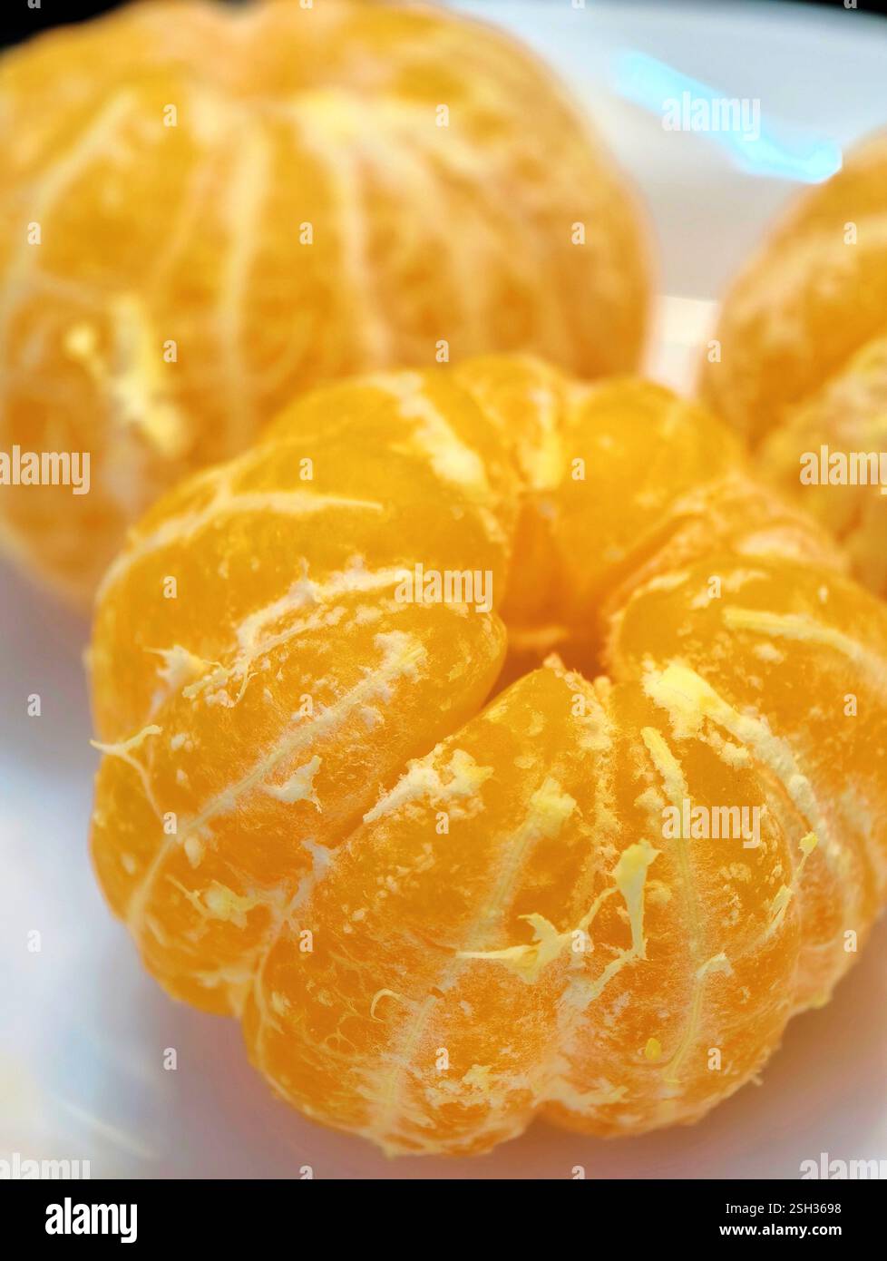 Sweetly segmented citrus fruits arranged beautifully on a plate ...