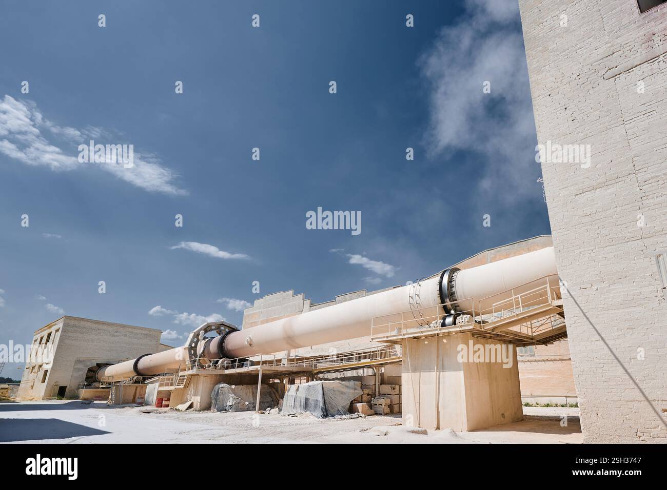 Concrete building of rotary kiln for silica production Stock Photo - Alamy