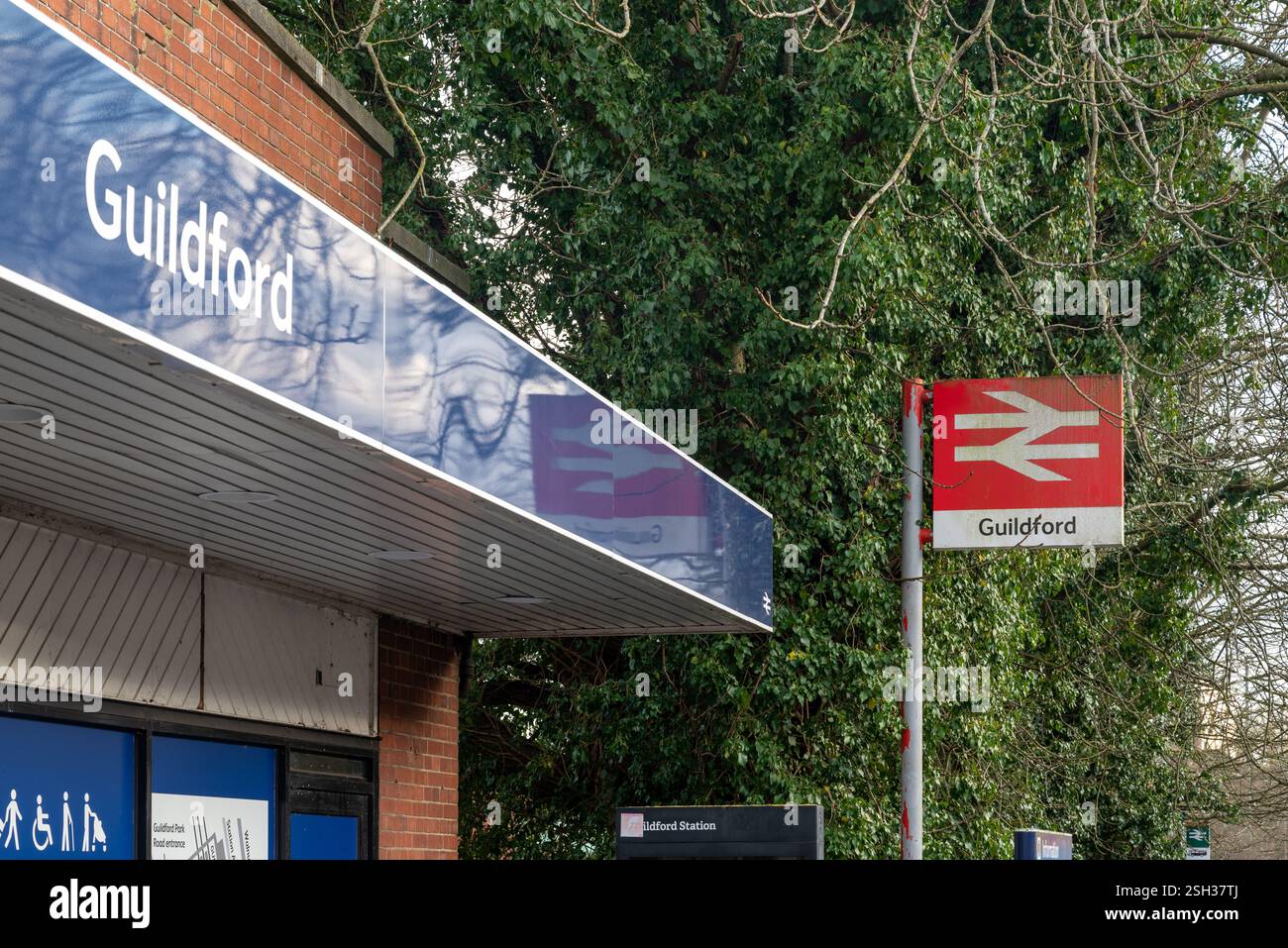 Signs at the entrance to Guildford train station. February 2025 Stock ...