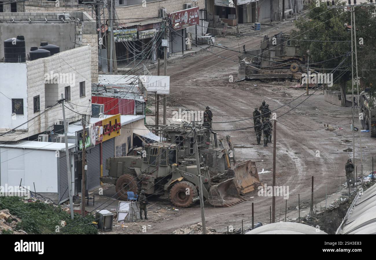 Tubas, Palestine. 10th Feb, 2025. Israeli soldiers take positions among ...