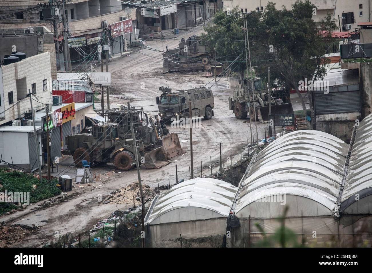 Tubas, Palestine. 10th Feb, 2025. Israeli military vehicles positioned ...