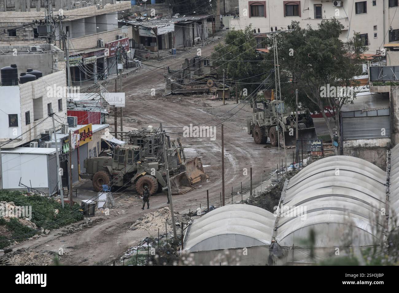Tubas, Palestine. 10th Feb, 2025. Israeli military vehicles positioned ...
