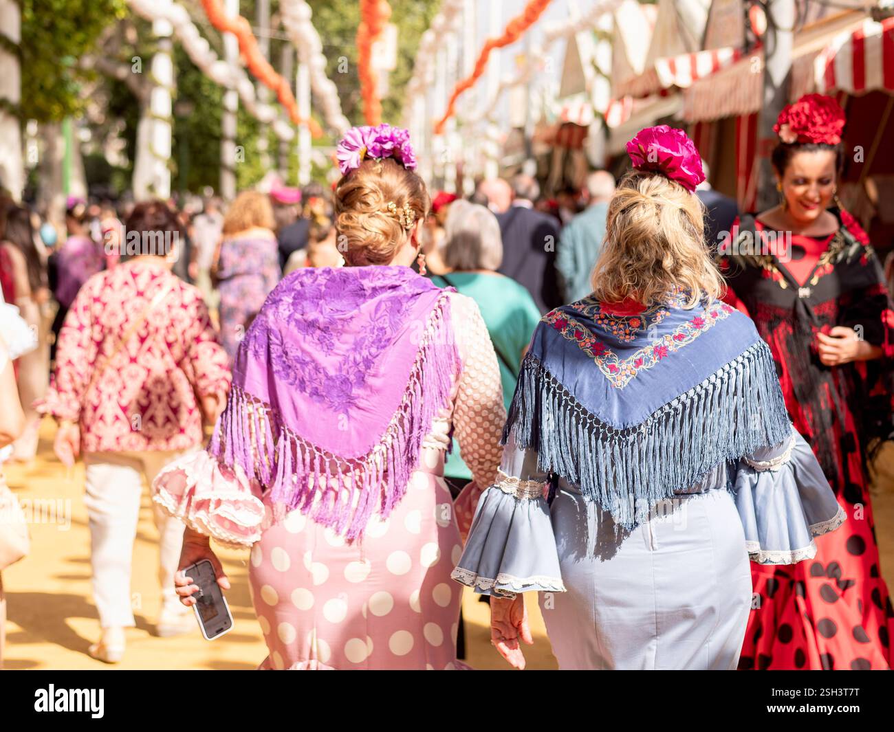 Vibrant Seville Fair. Women in Traditional Flamenco Dresses Stock Photo ...