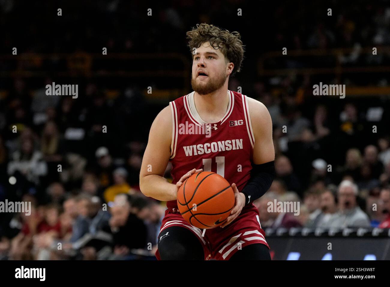 Wisconsin guard Max Klesmit drives up court during the first half of an ...