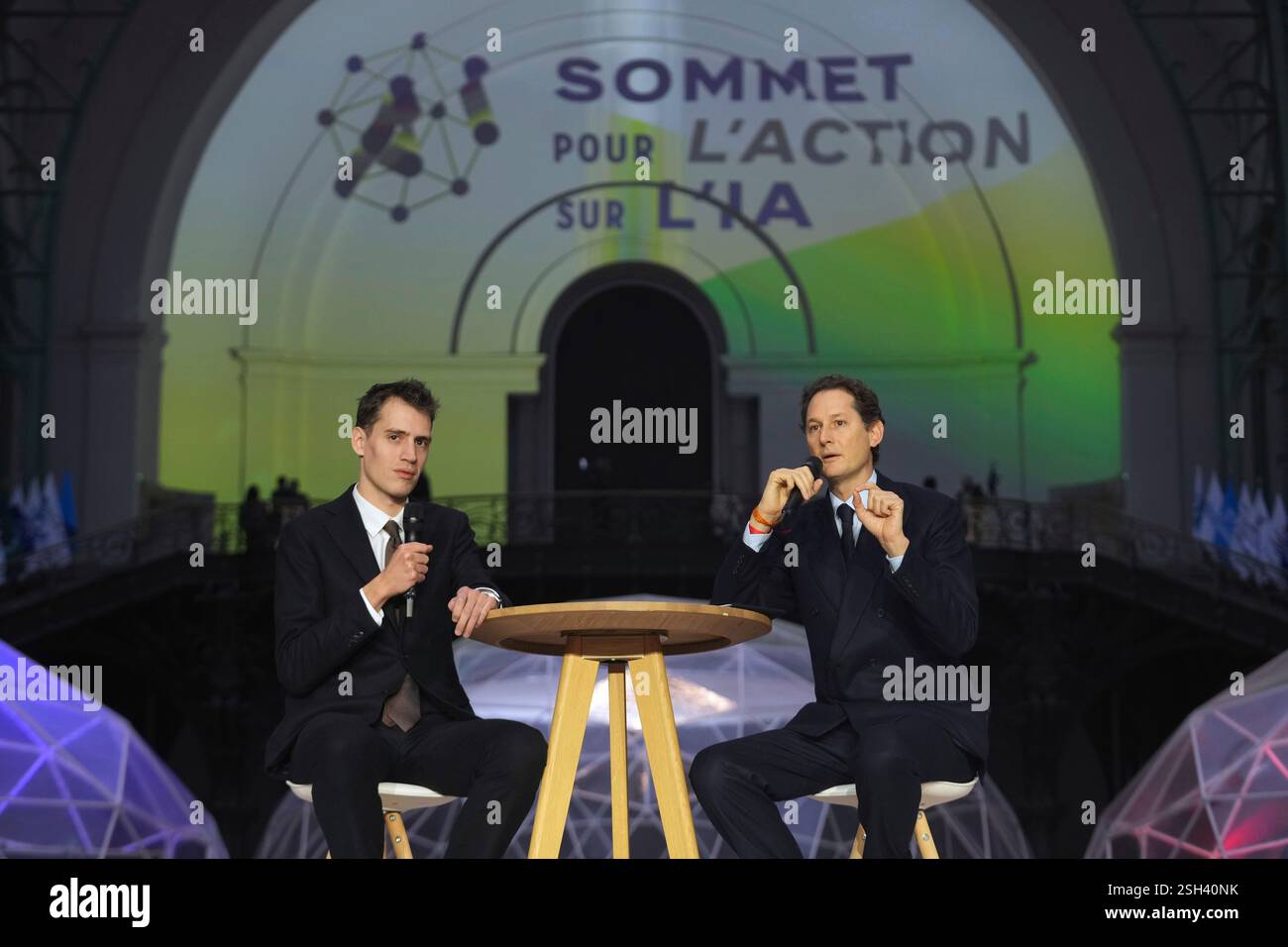 Arthur Mensch, CEO of Mistral AI, left, and John Elkhann, CEO of Exor ...