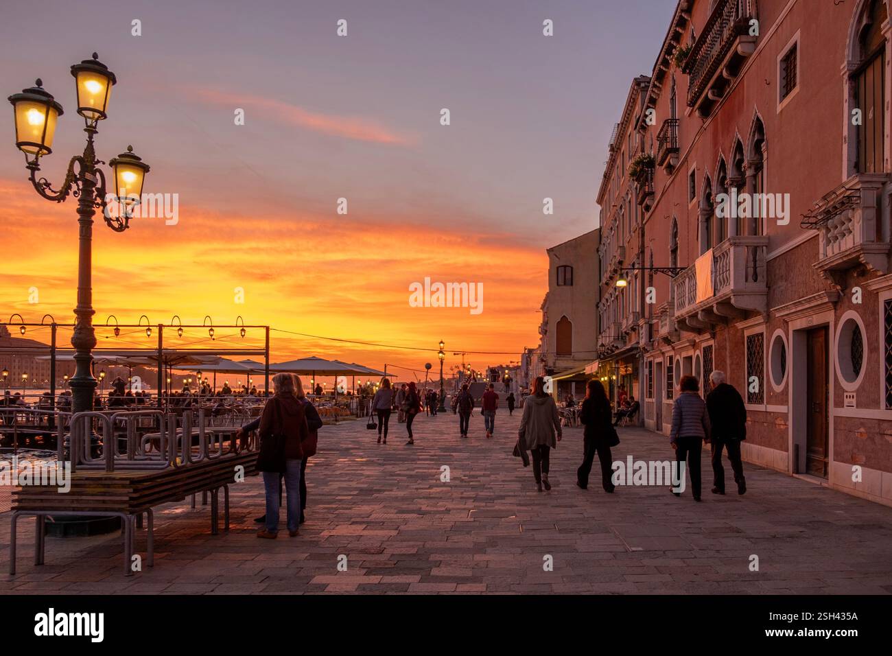 Red blood sky sunset over Venice Lagoon with Salute Basilica domes and ...
