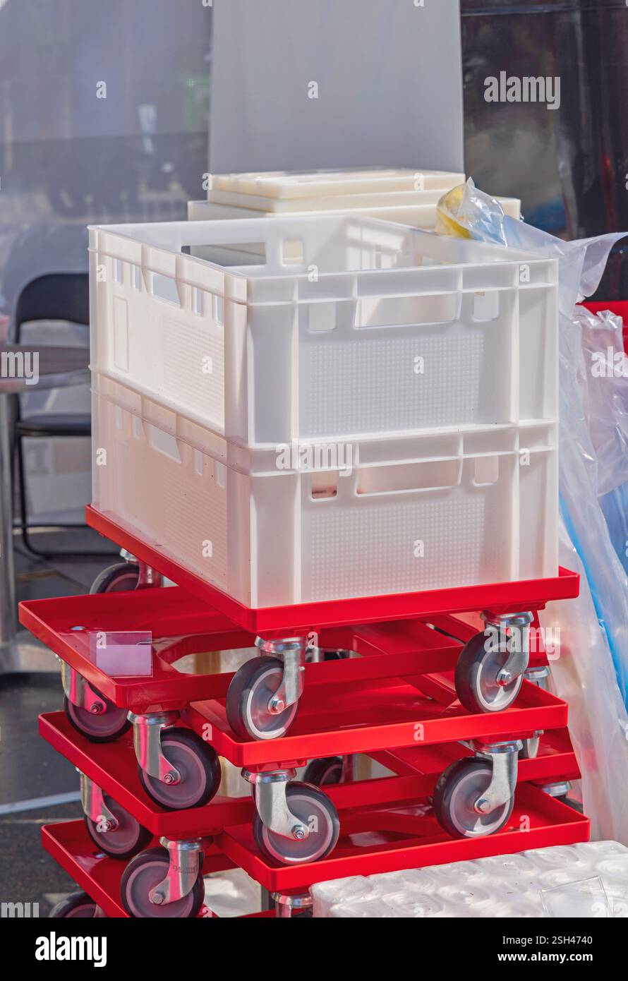 Stacked Plastic Crates at Skid Wheels Cart Transport Stock Photo - Alamy