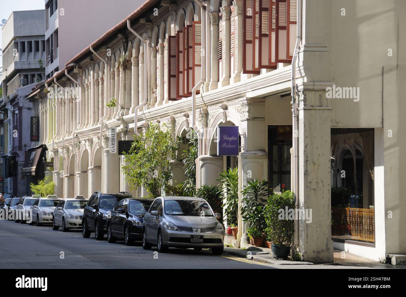 A street lined with British Colonial styled buildings along Purvis ...