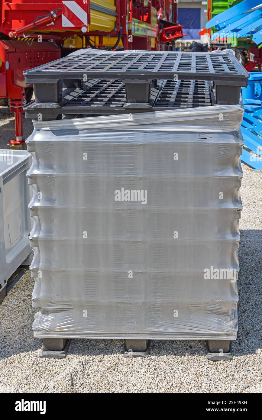 Stacked Plastic Pallets in Wrap Foil for Agriculture Industry Stock ...
