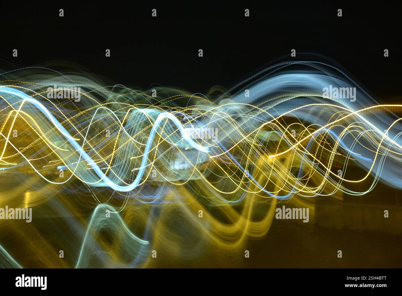 Nocturnal composition of undulating lines of light on the surface of ...