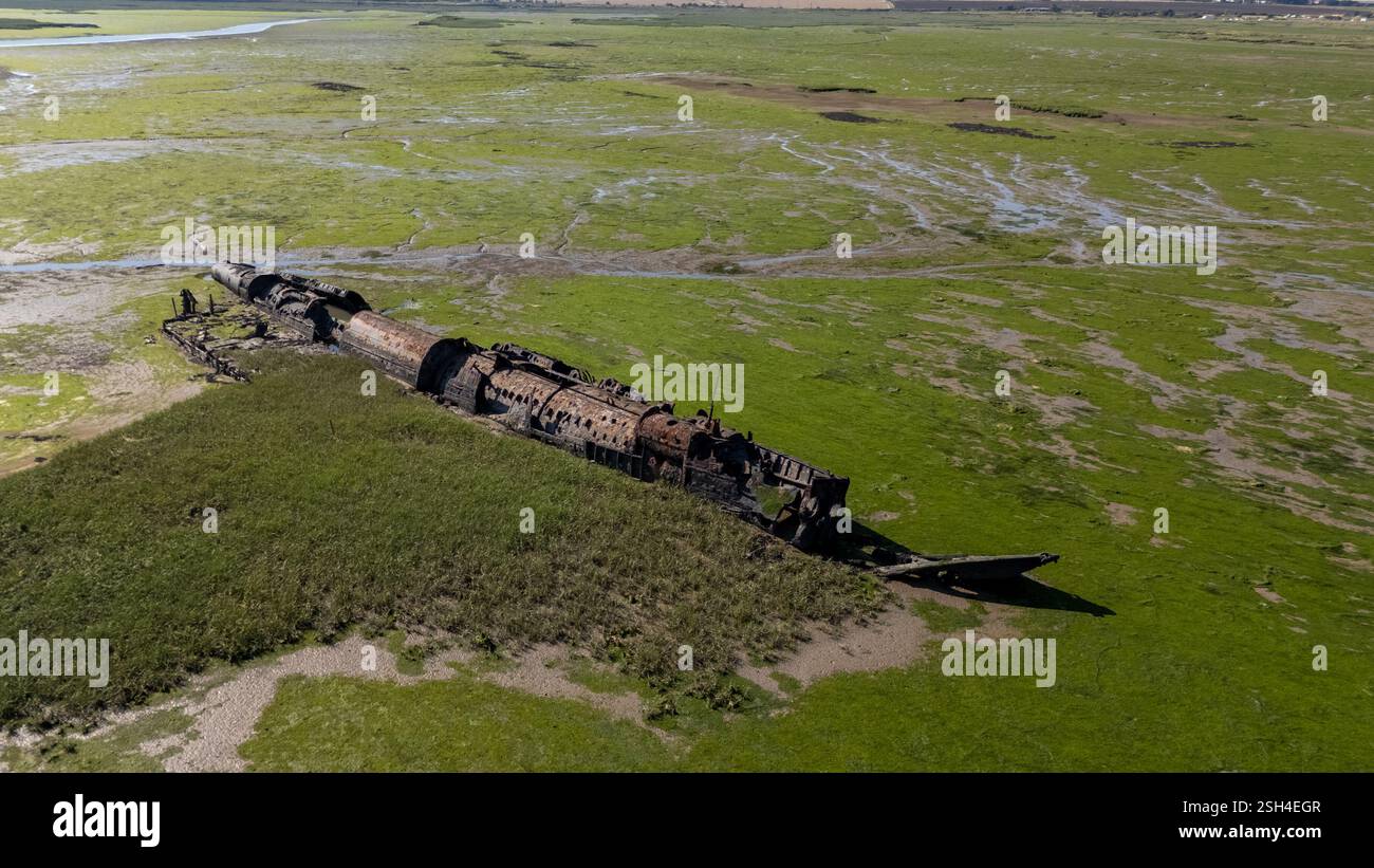 Aerial view of a rusted German UBoat shipwreck partially covered by ...
