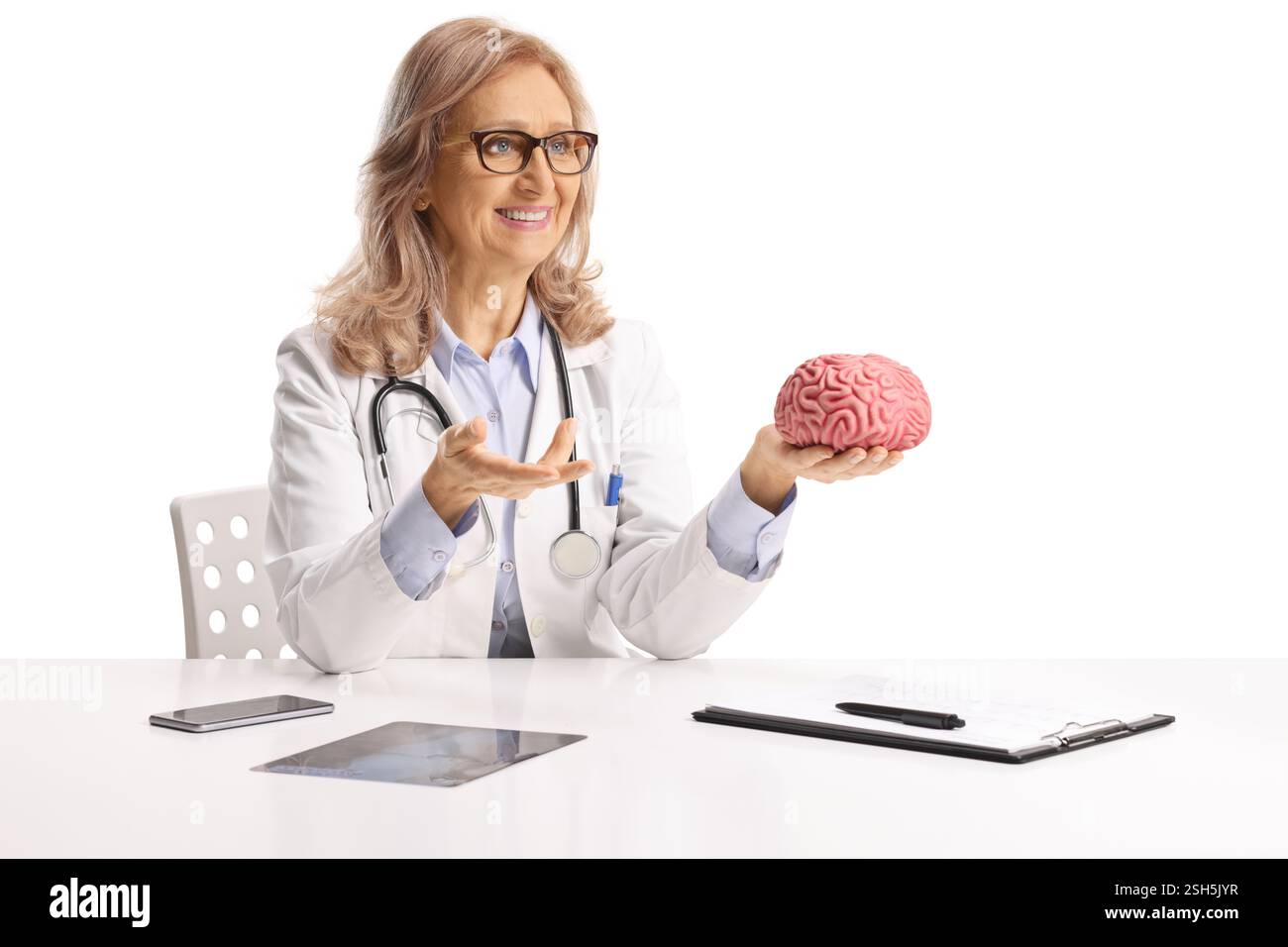 Female doctor holding a brain model and talking isolated on white ...