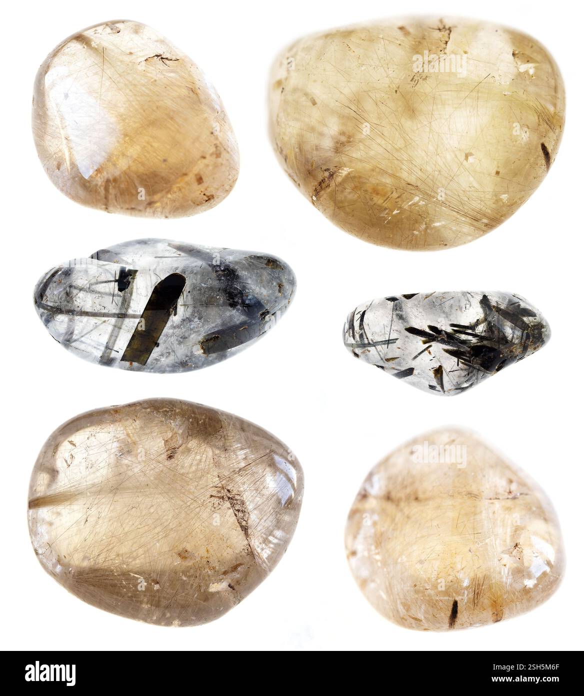 various specimens of uncut quartz rocks with inclusions cutout on white ...