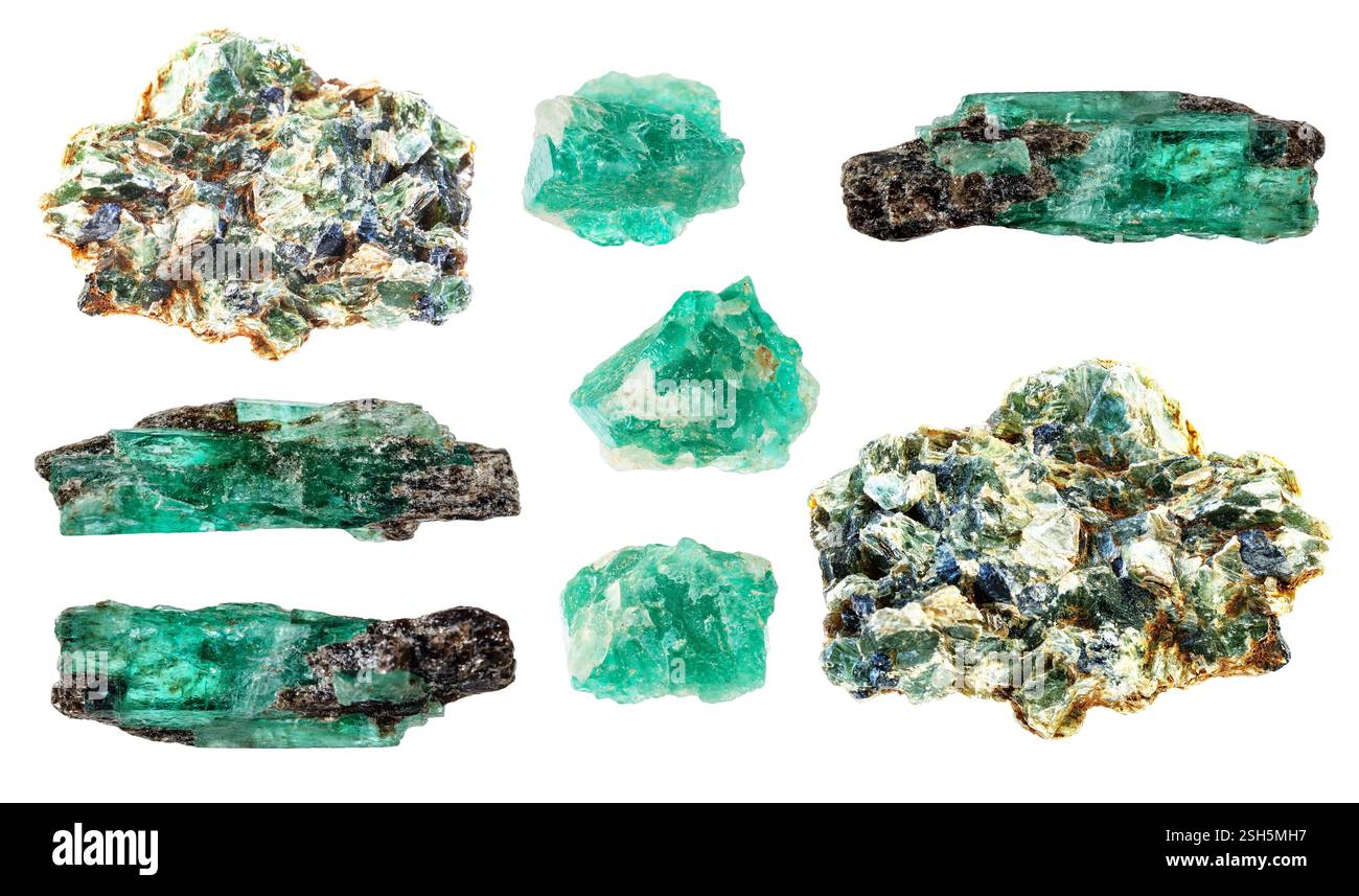 various specimens of uncut emerald green beryl rocks cutout on white ...