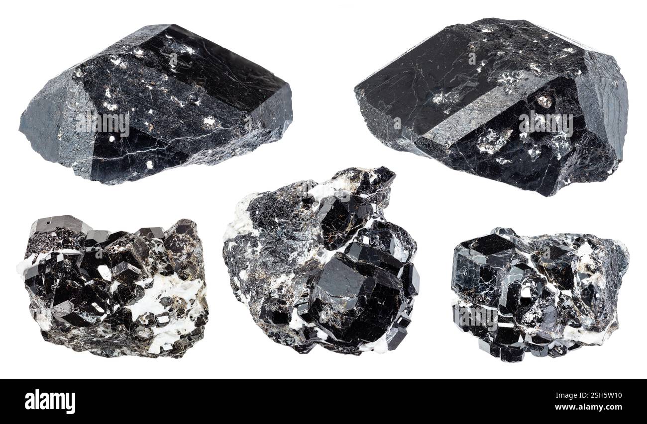 various specimens of uncut melanite black garnet rocks cutout on white ...